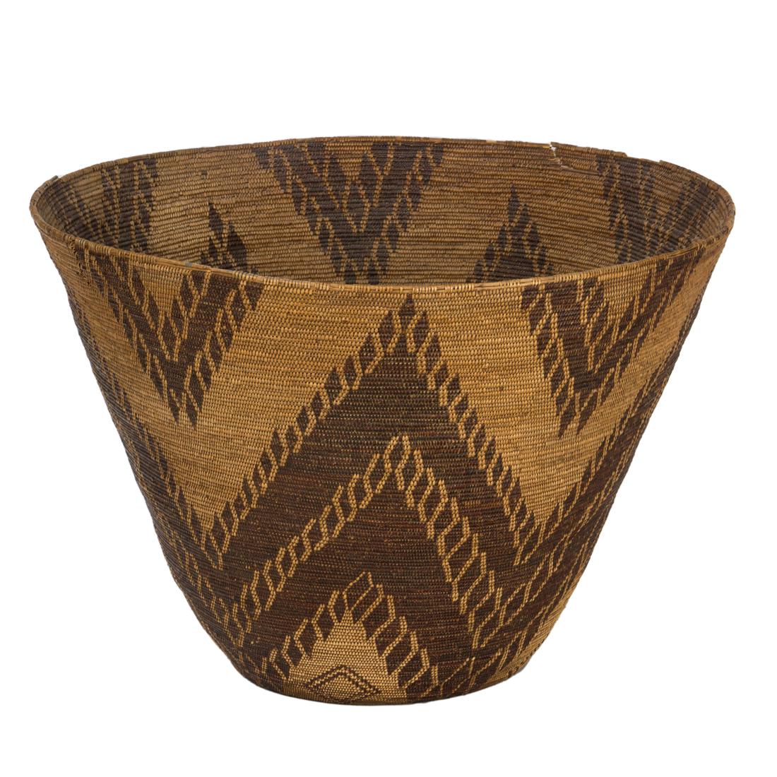 A Large Native American Basket With Dramatic Chevron Designs Encircling