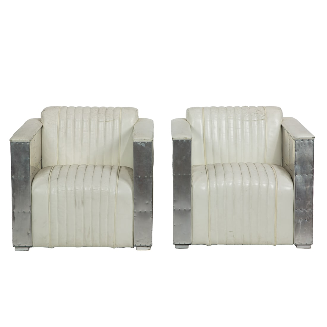 A Pair Of Aviator Style Channel Tufted And Riveted Metal Lounge Chairs