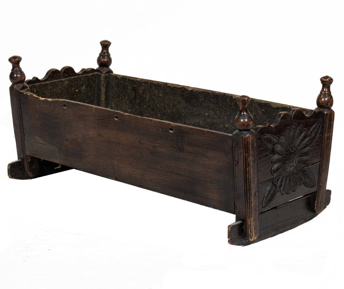 A Primitive Carved Cradle Auction