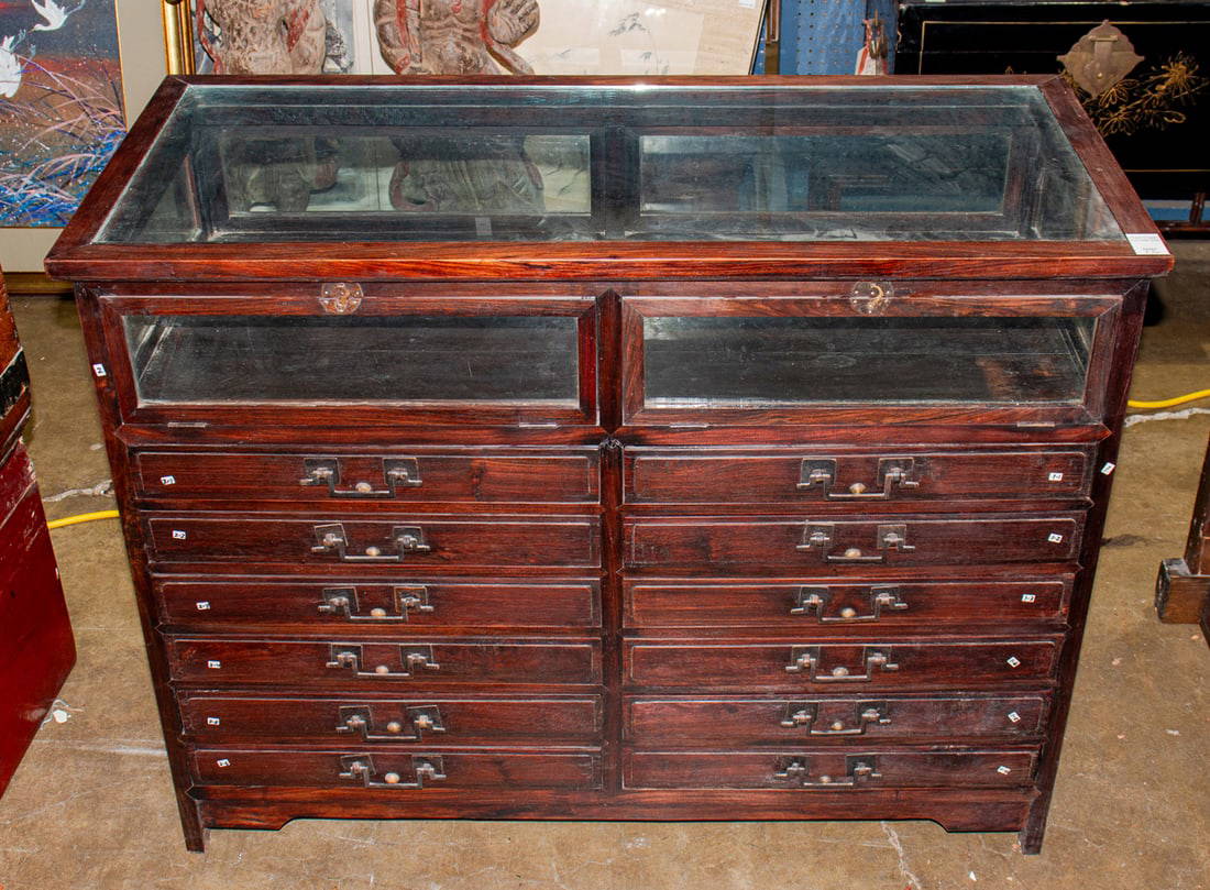 A Chinese Rosewood Showcase Cabinet With Drawers Auction