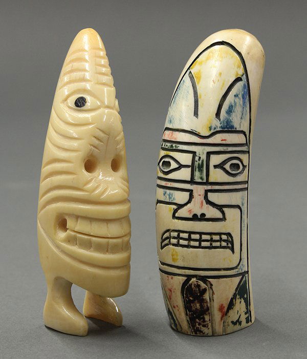 Carved whale teeth