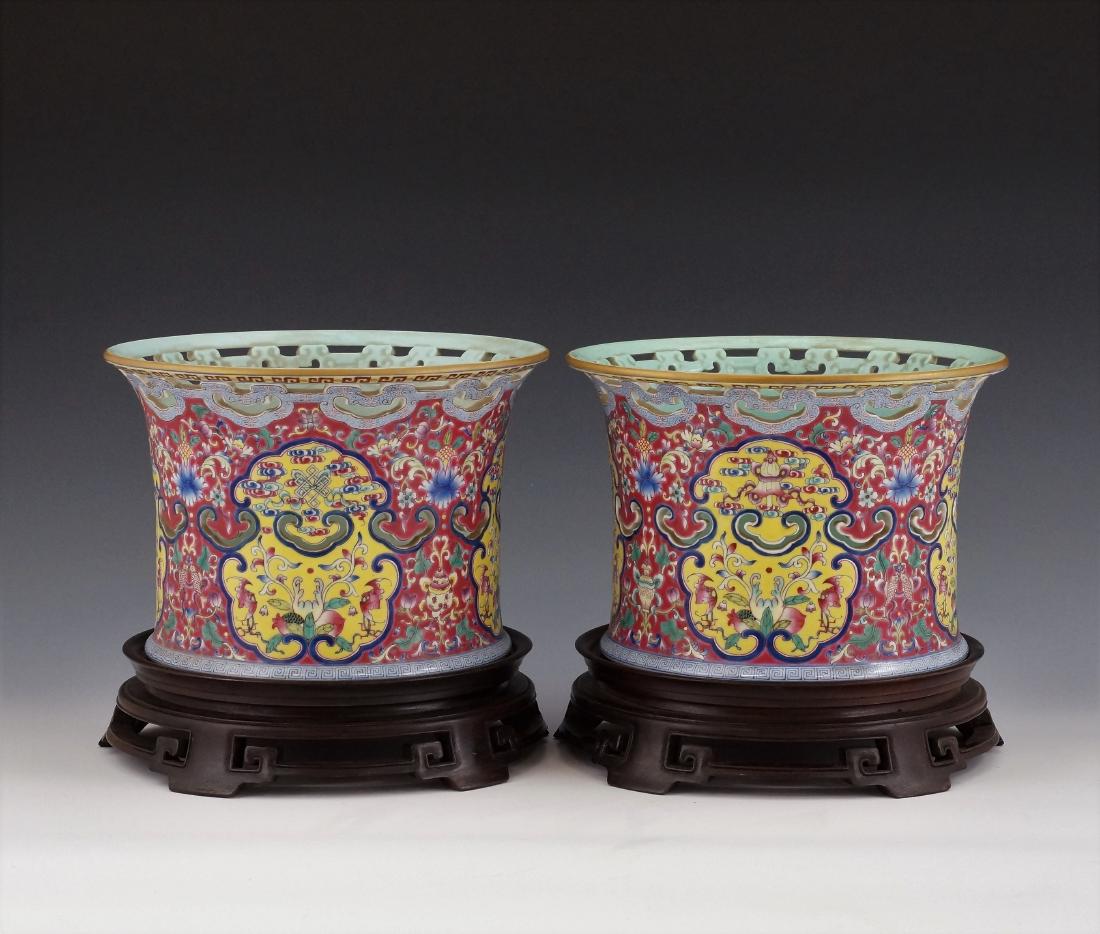 PAIR OF CARVED FAMILLE ROSE PORCELAIN PLANT POTS