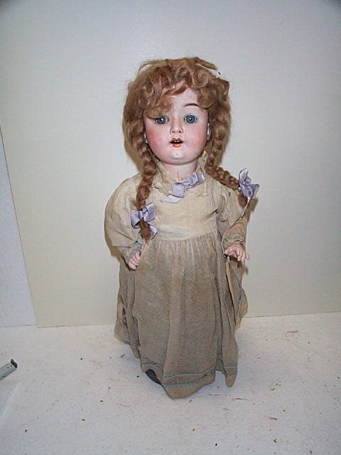 649: 19" German porcelain head doll, with a composition