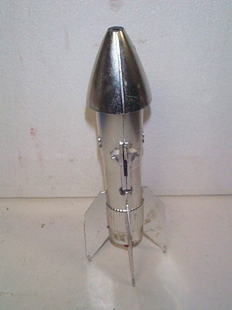 125: Mechanical Rocket ship bank signed: Vacumet 1957