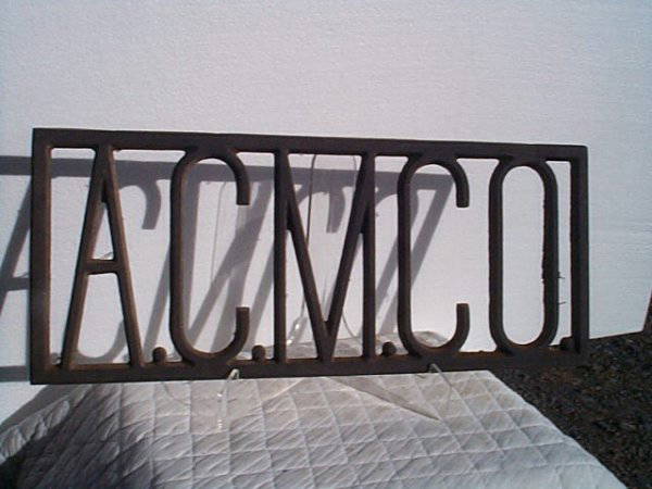 Cast Iron Name Plate. Reads A. C. M. Co.. Measur