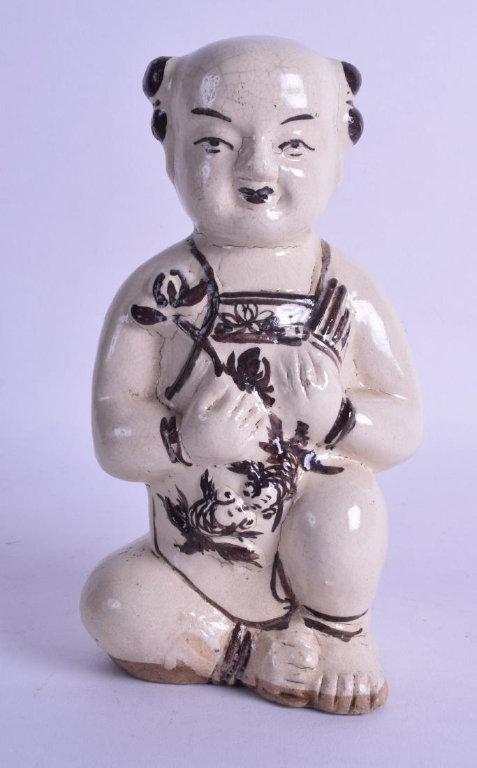AN UNUSUAL EARLY CHINESE CHIZOU POTTERY FIGURE OF A BOY