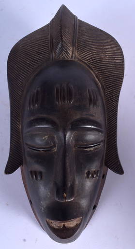 A Gabonese Wooden Punu Mask, Carved With Scarification