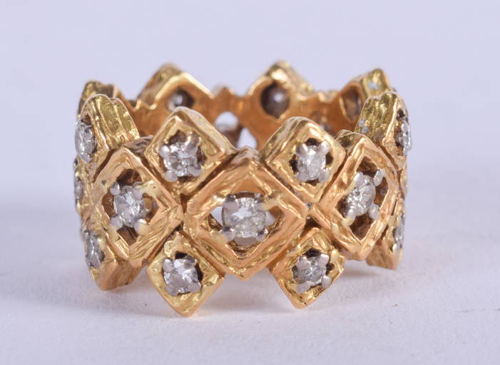 An 18ct Gold And Diamond Open Work Ring. 15.4 Grams.