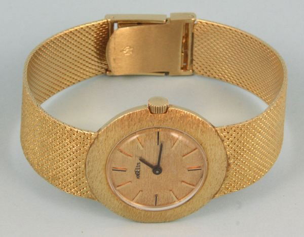 1017: Woman's 14k yellow gold Angelus watch