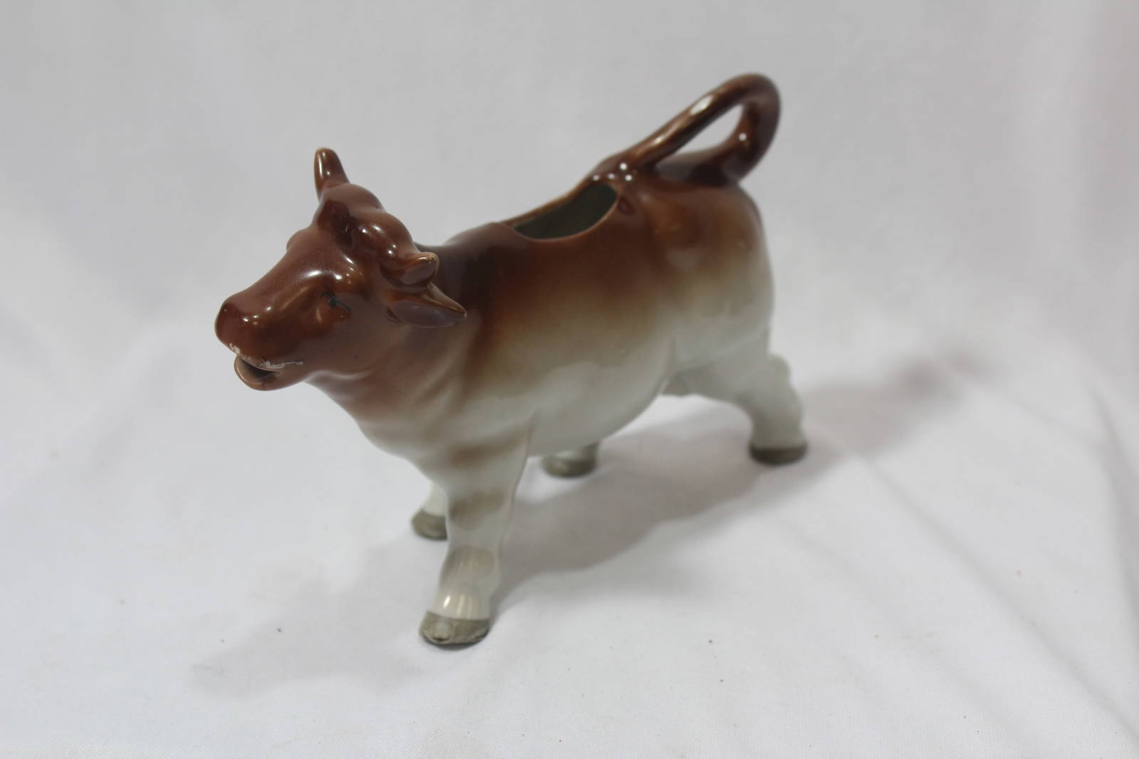 A Ceramic Cow Container Auction