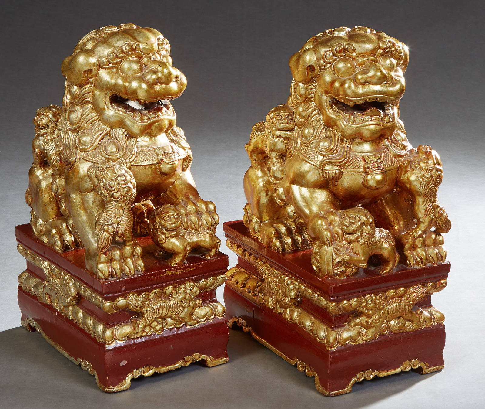 Pair Of Chinese Gilt And Carved Red Lacquered Wood Foo Dogs, 20th C., H ...
