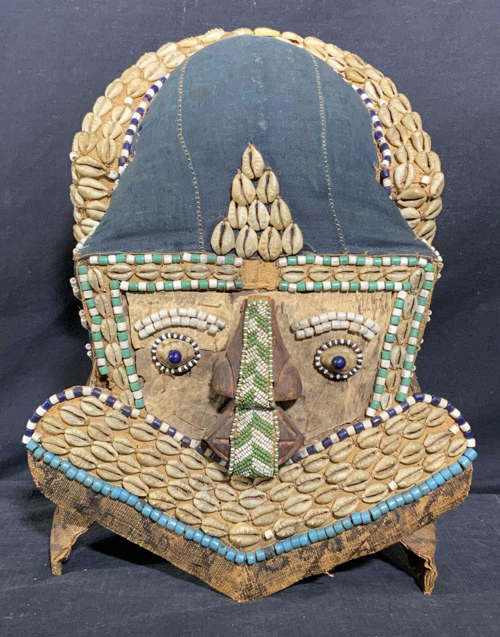 African Composite Cowrie Shell Mask for Rituals | Barnebys