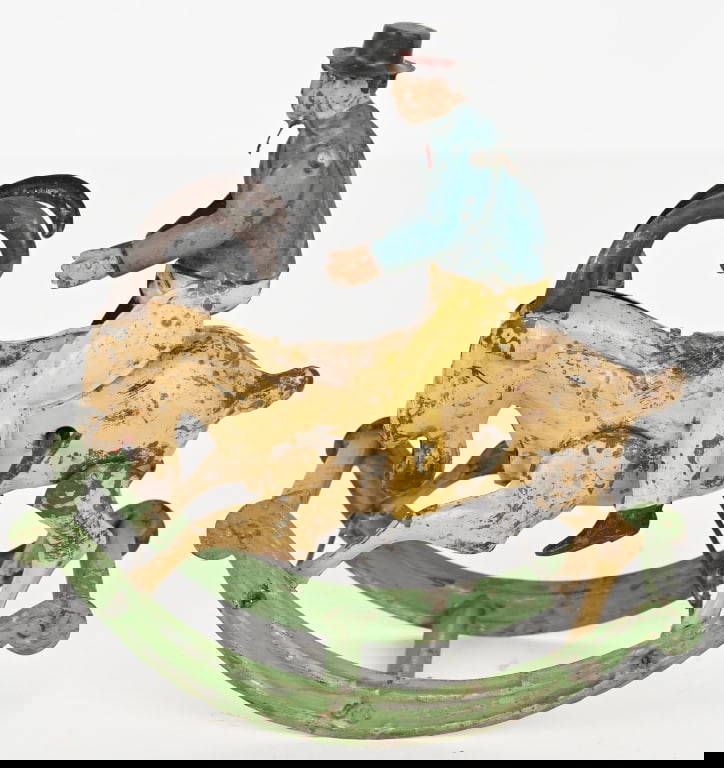 German Hand Painted Tin Man Riding Goat Auction