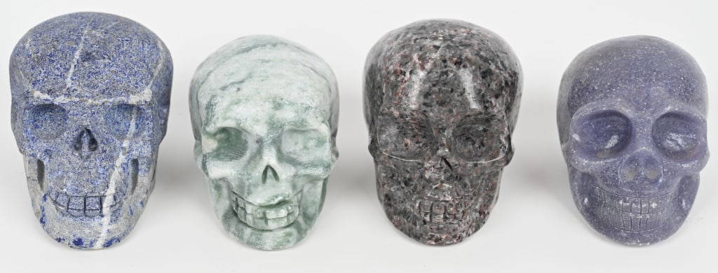 4- Carved Stone Skulls Auction