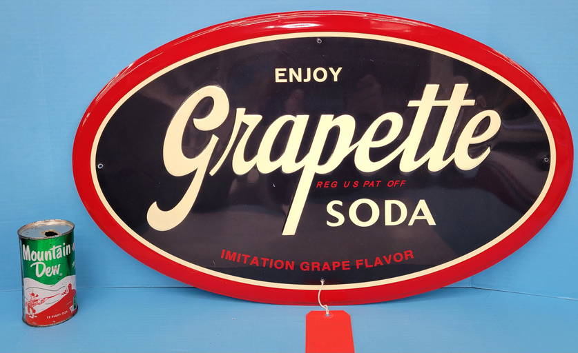 Enjoy Grapette Soda Embossed Oval Tin Sign