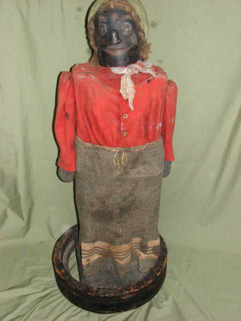 100: Early Folkart mammy statue from Maine original.