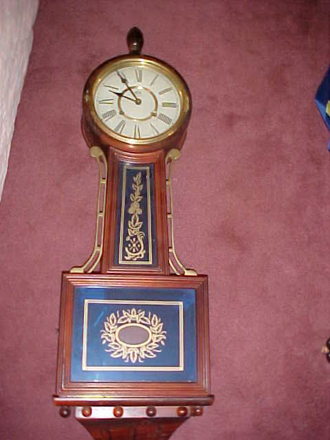 Time Manufacturing Co. Mahogany Case Wall Clock.