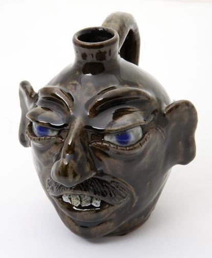 56: Daniel Boone, "face jug " Fired and glazed pottery