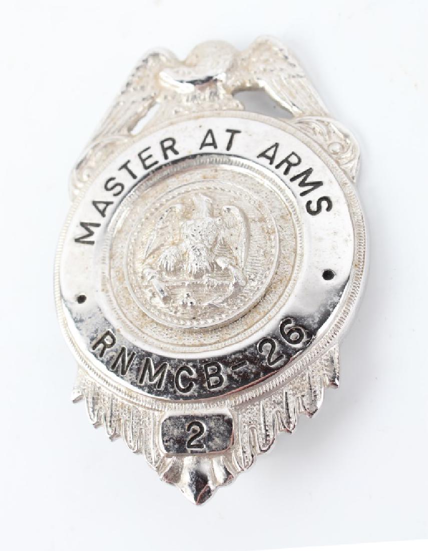 20TH C. US NAVY RNMCB-26 MASTER AT ARMS BADGE