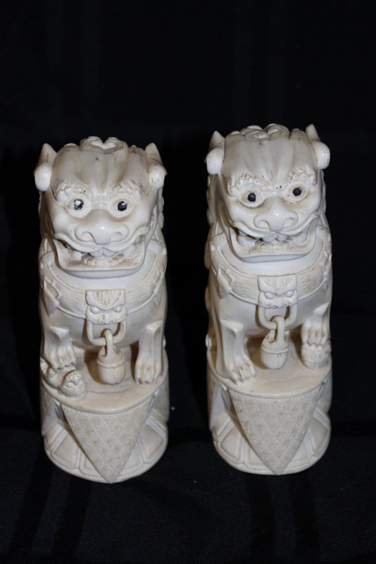 Pair of Chinese Carved Ivory Foo Dogs