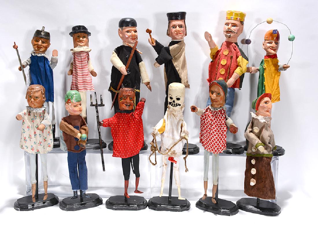 12 Antique Puppets.