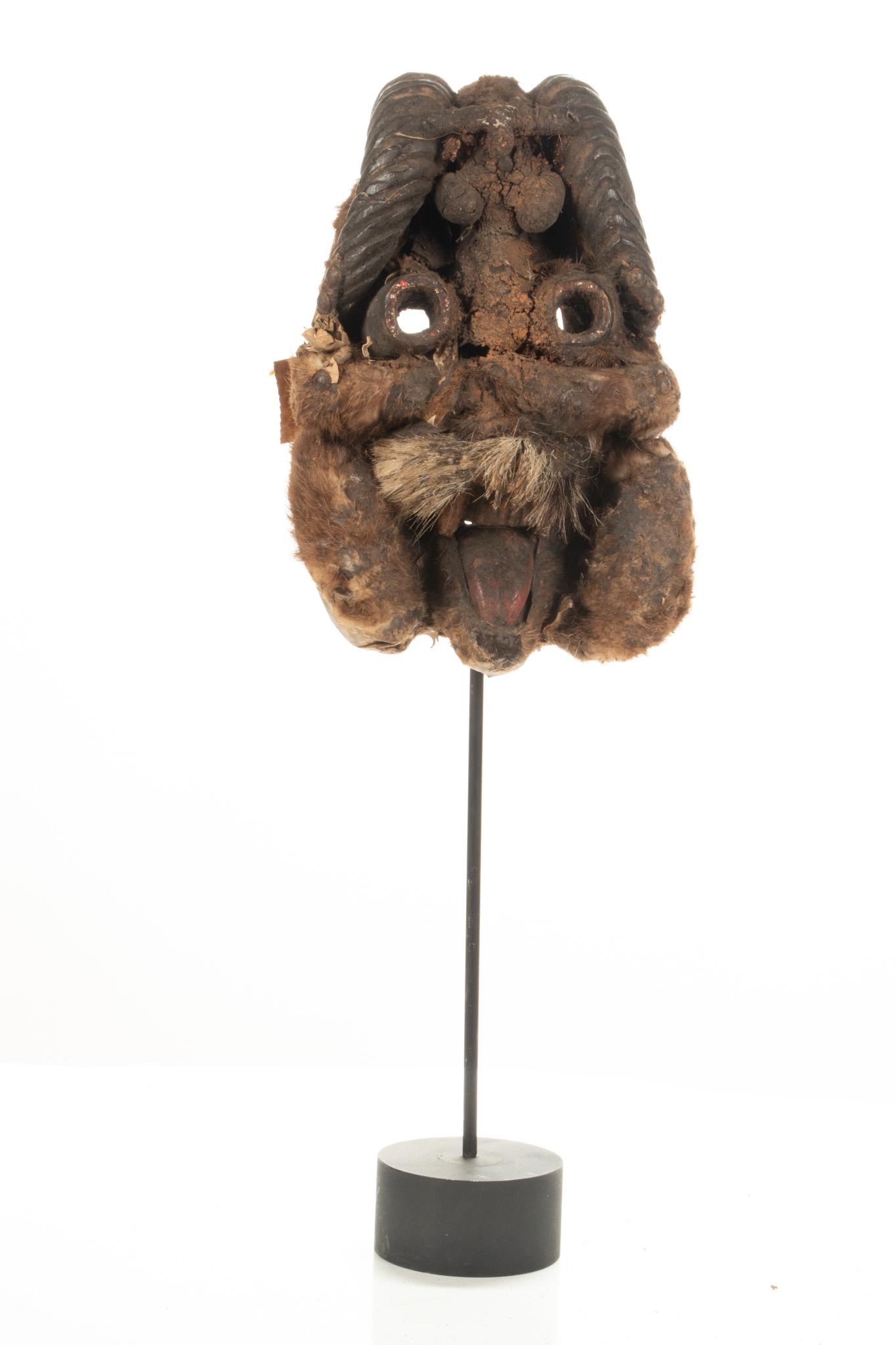 African Carved Wood, Fiber And Animal Fur Mask On Black Stand. - Mar 17 ...