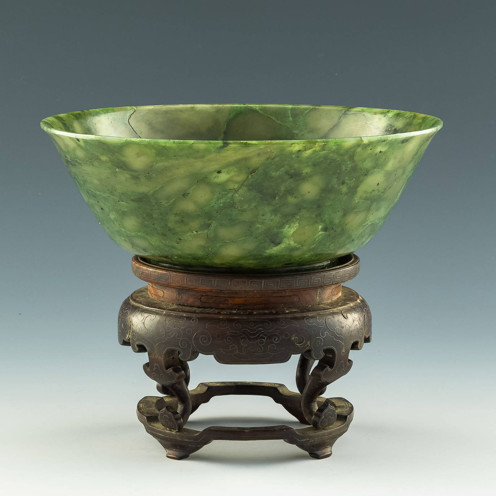 A Chinese Carved Spinach Jade Bowl, 19th Century Auction
