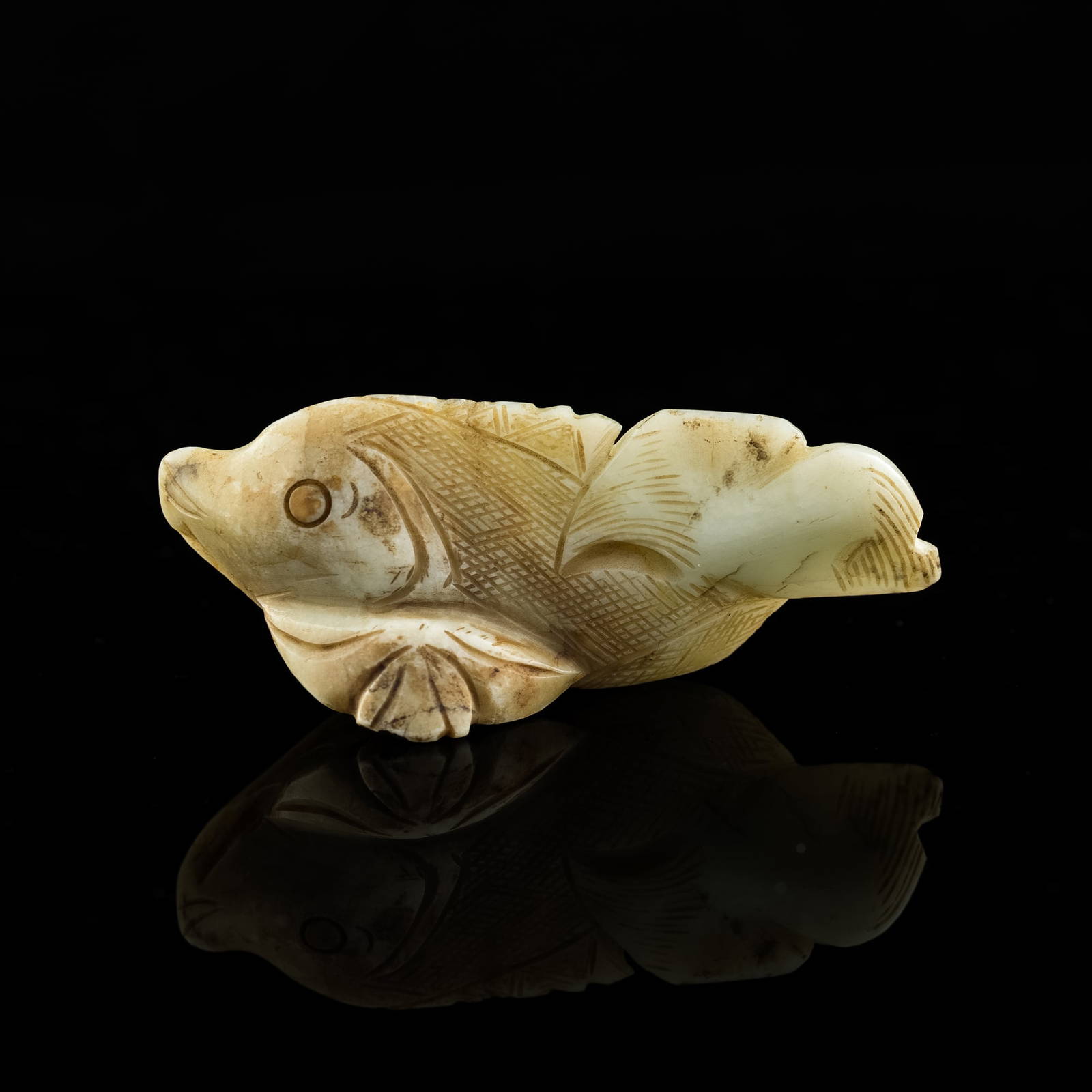 A Chinese Carved Jade 'fish' Figure, Ming Dynasty Auction