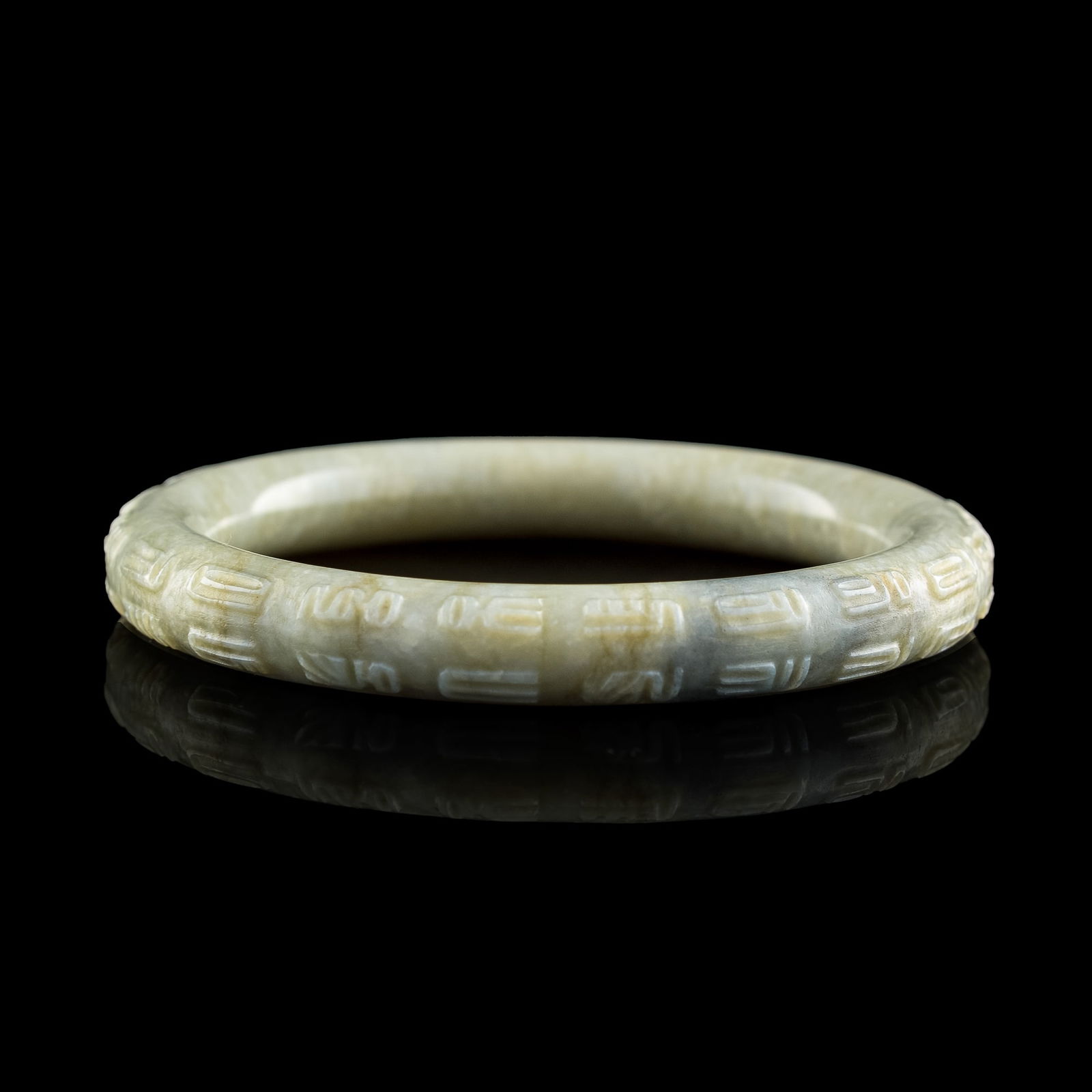 A Chinese Carved Jade Bangle With Characters, Ming Dynasty Auction