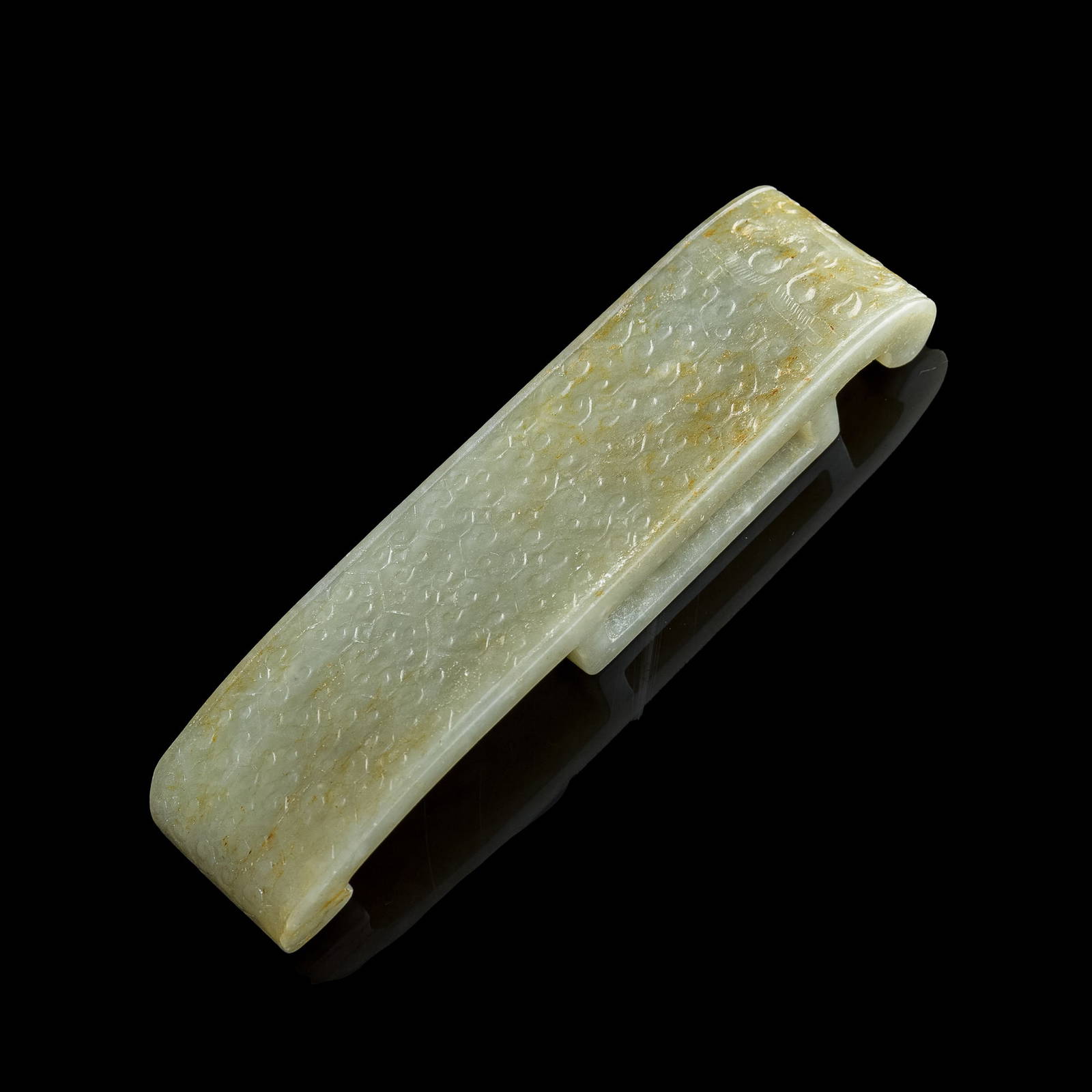 A Chinese Carved Jade Sword Slide, Ming Dynasty Or Earlier Auction