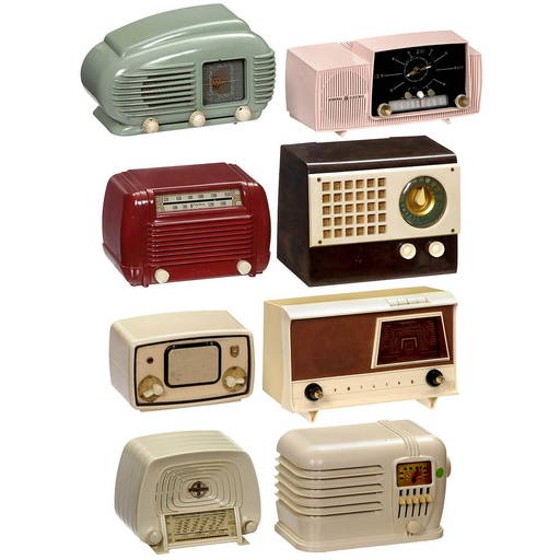 Eight Small Radio Receivers In Plastic Cases