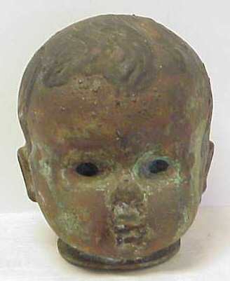 1011: BRONZE BABY HEAD (MOLD FOR DOLLS HEADS), 7" X 5 1