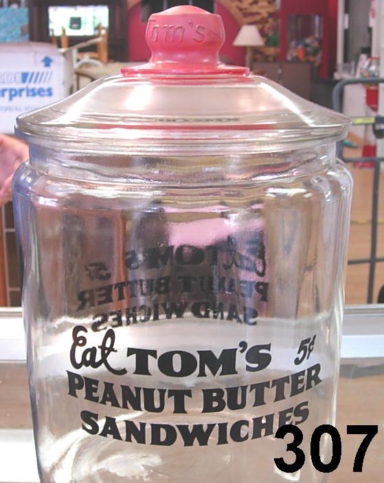 90307: ANTIQUE TOMS JAR ADVERTISING JAR W RED KNOB LID