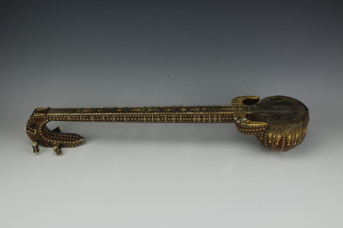 A Rawap Musical Instrument from Xinjiang China Snakeski