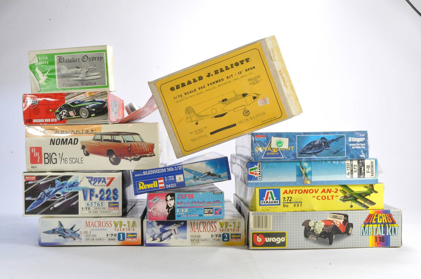 A Group Of Plastic Model Kits From Various Makers Including Italeri ...