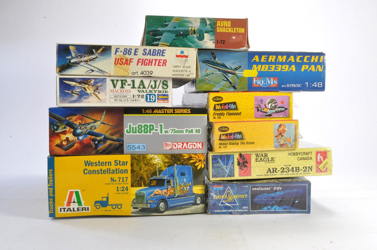 A Group Of Plastic Model Kits From Various Makers Including Italeri ...