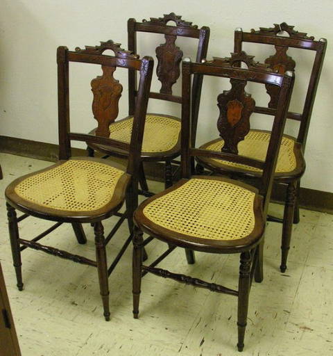Four Carved Walnut Cane Bottom Chairs