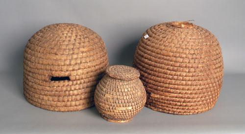 1028: Two rye straw bee skeps, together with a lidded b