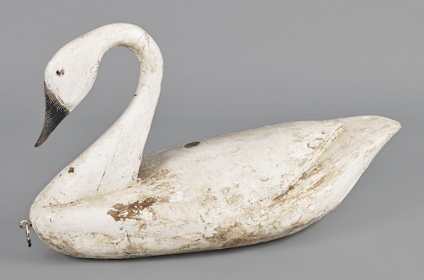Carved and painted swan decoy, 20th c., 35'' l.