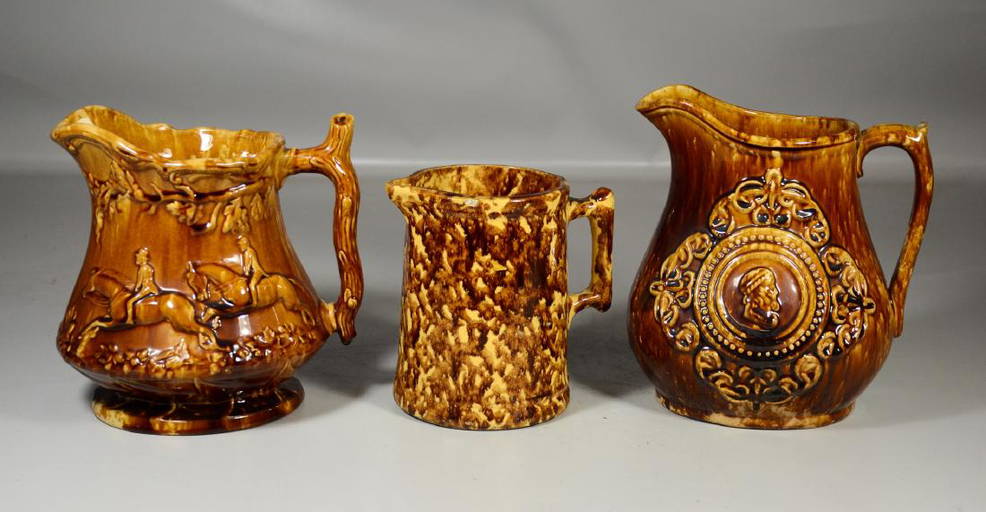Three (3) Rockingham Bennington Style Pitchers, One