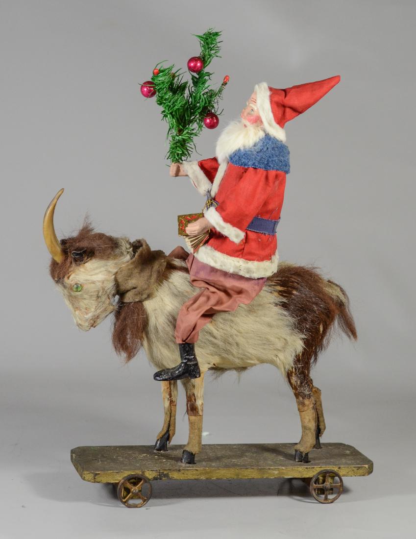 Santa Claus riding goat pull toy with fur, horns,