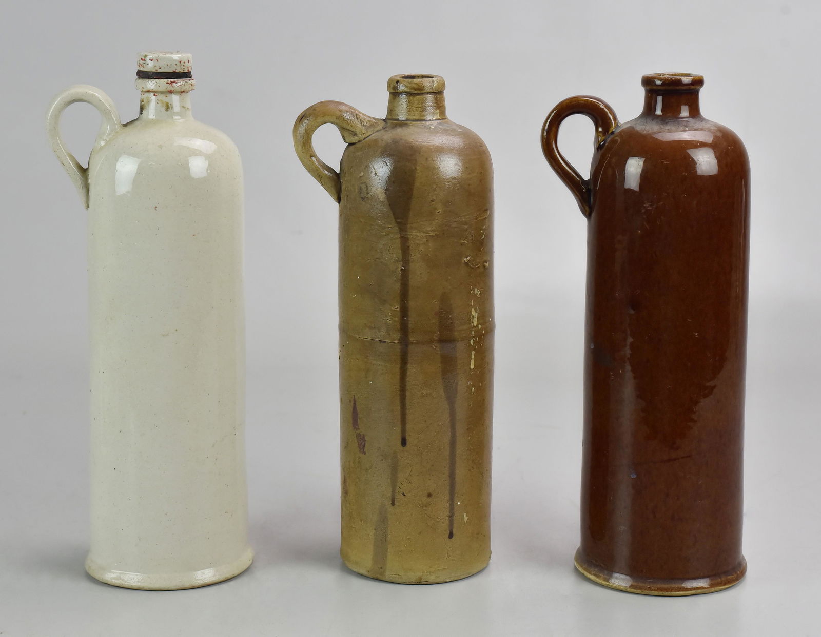 (3) Stoneware Bottles