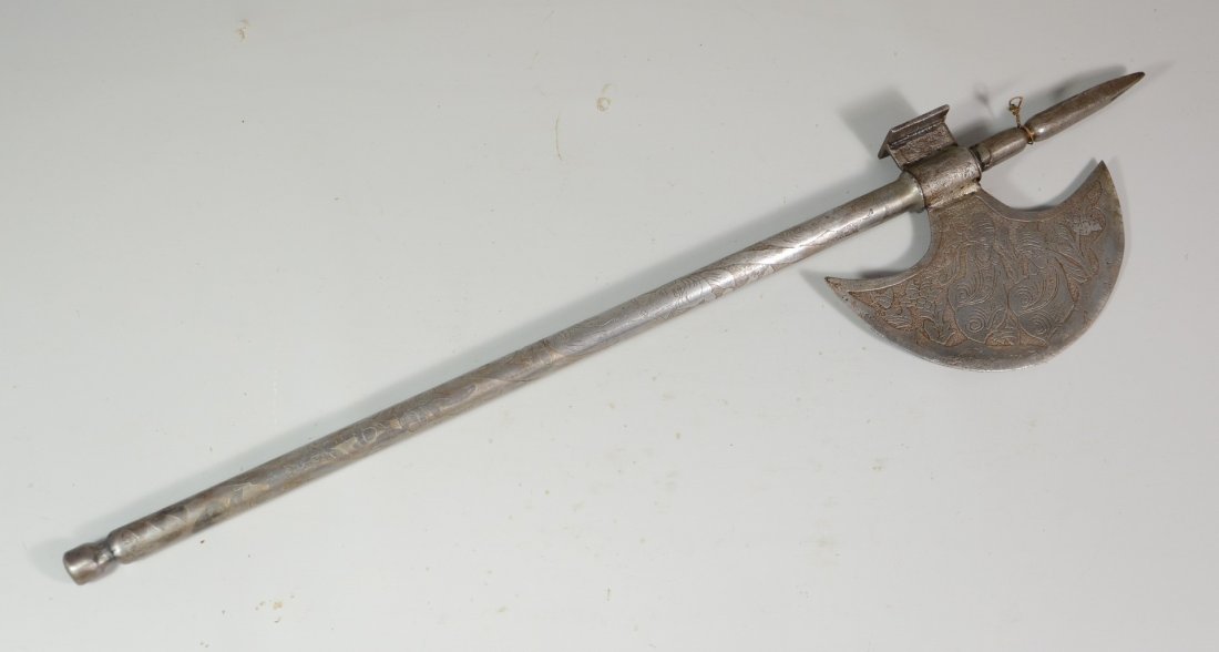 Persian halberd with engraved figures on blade and