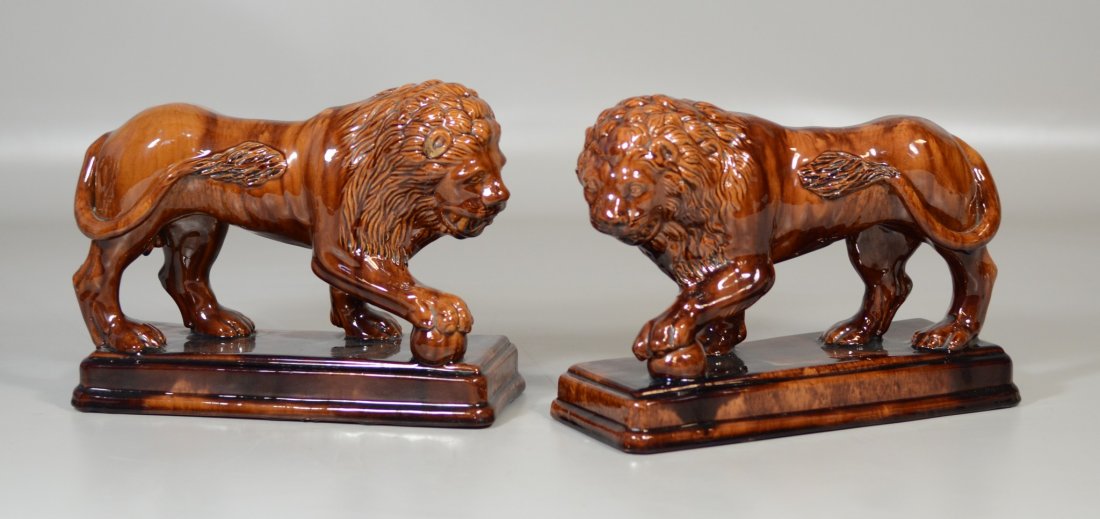 Pair Of Rockingham Style Treacle Glaze Lion Figures