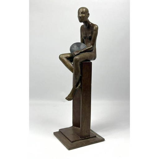 Figural Mid Century Modern Bronze Sculpture. Seated Man Atop Tall Column.