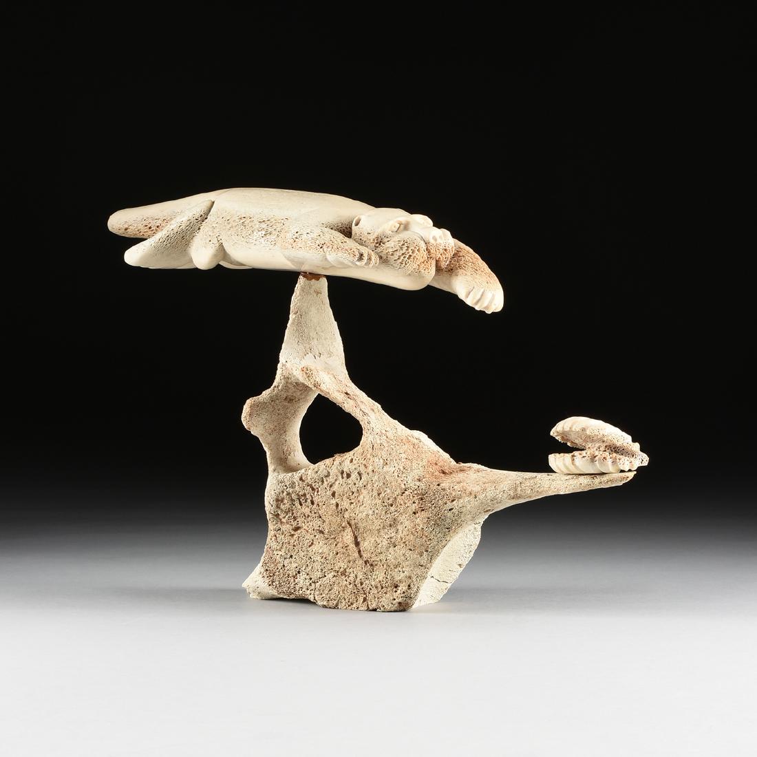 A NATIVE AMERICAN CARVED WHALE BONE AND VERTEBRAE
