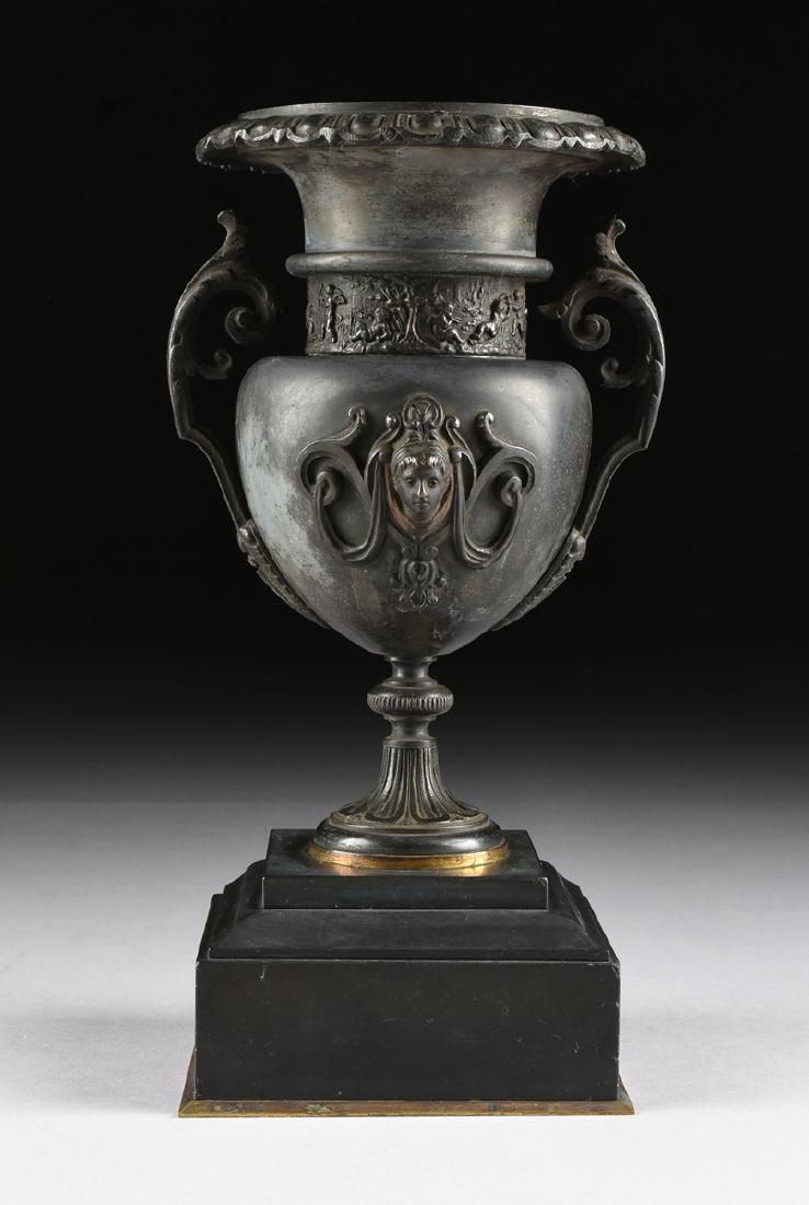 A PAIR OF BALDUC FRERES PATINATED METAL URNS ON BLACK