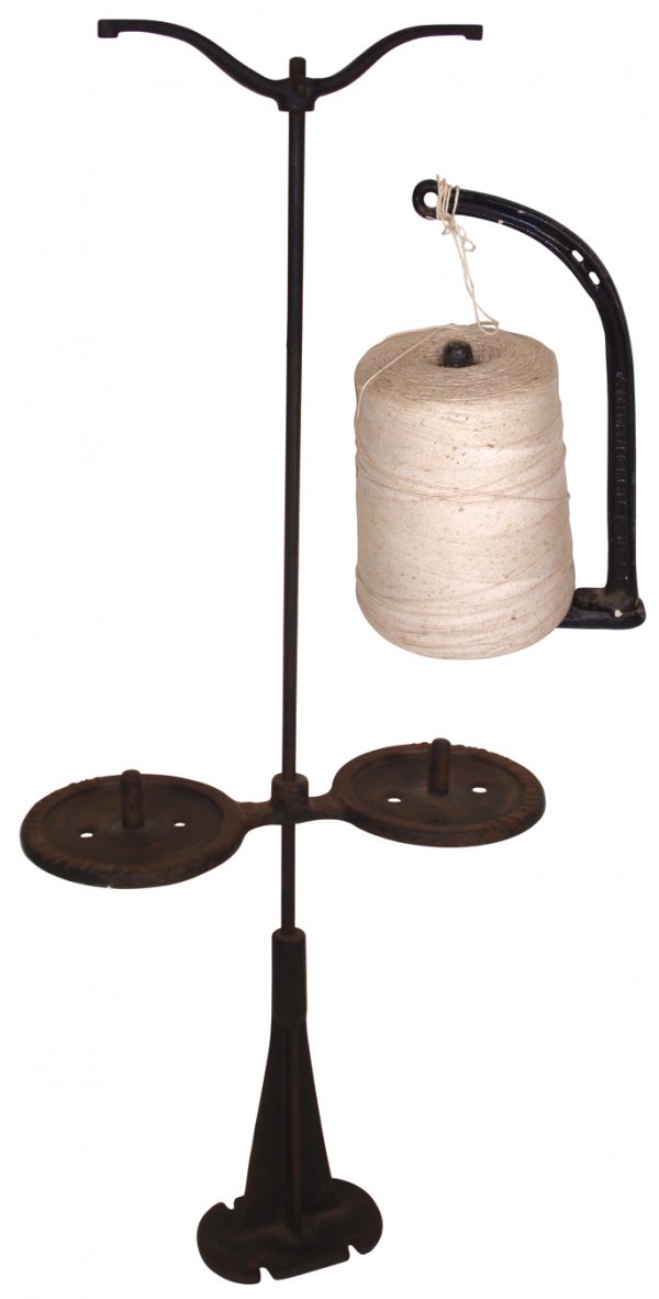 0737: String holders (2), double cast iron holder embos