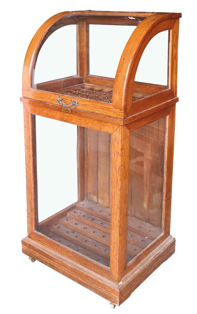 Country Store Cane Display Case, oak w/curved glass | Barnebys