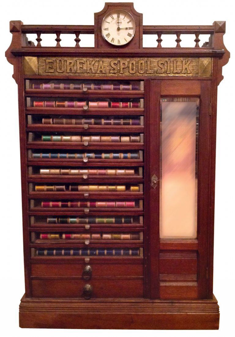 Spool cabinet, Eureka, walnut w/clock gallery, mirrored